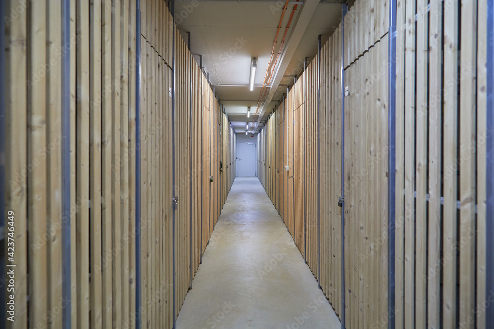 Cellar compartment in a residential building. The compartments are ...