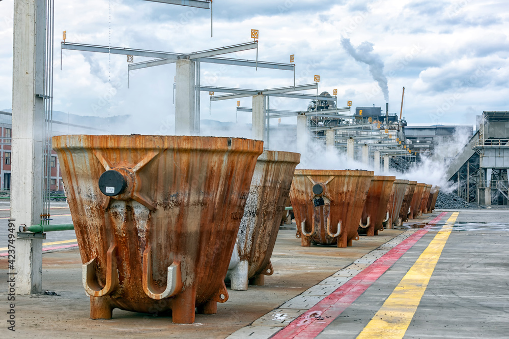 Hot slags in the melting pots in the copper processing factory. Copper ...