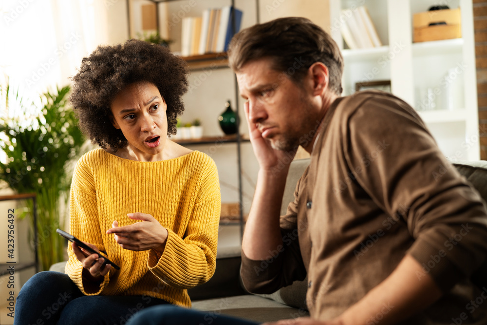 Frustrated young couple arguing at home. Stressed unhappy wife and ...