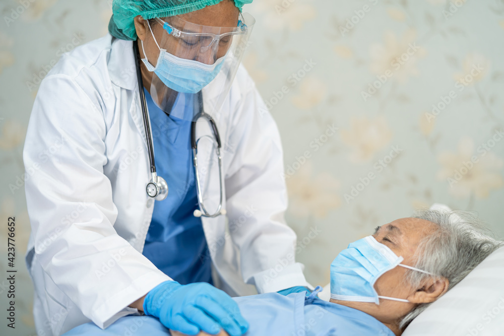 Asian doctor wearing face shield and PPE suit new normal to check ...