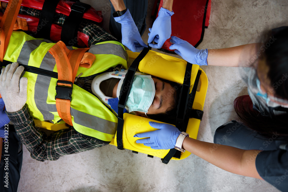 First aid for injuries in work accidents. Using first aid equipment ...