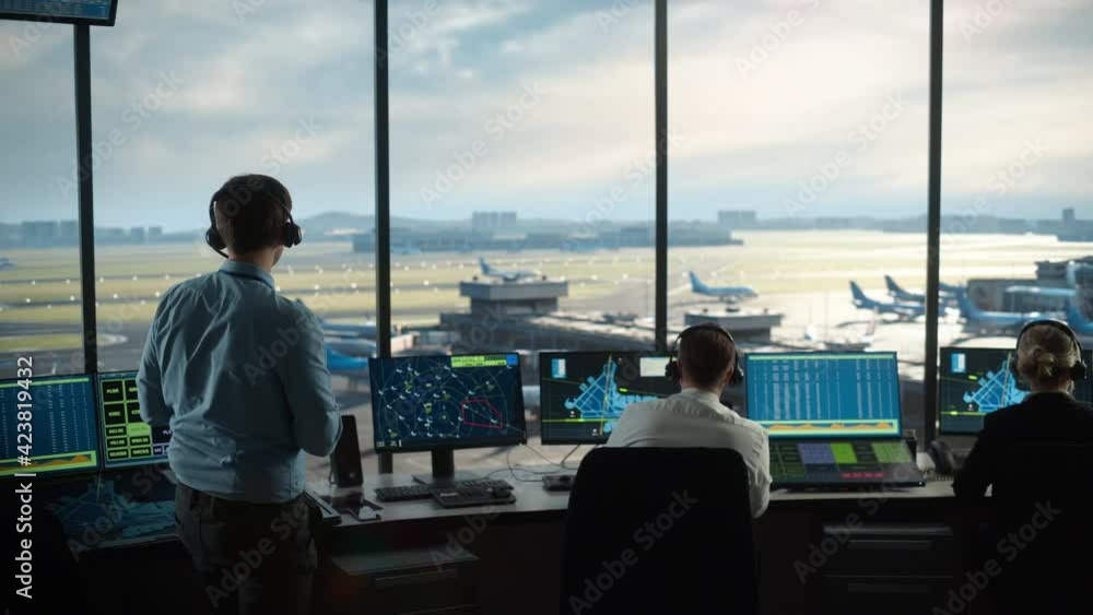 Diverse Air Traffic Control Team Working in a Modern Airport Tower ...