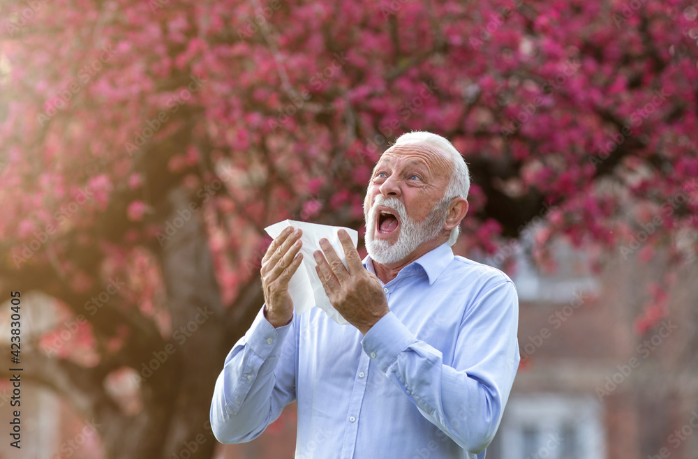 Old man having spring allergy reaction Stock Photo | Adobe Stock