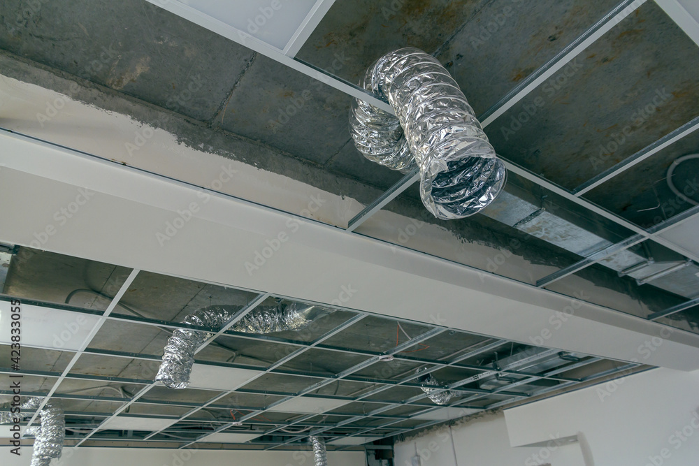 The hanging ceiling in the office under construction. The ceiling false ...