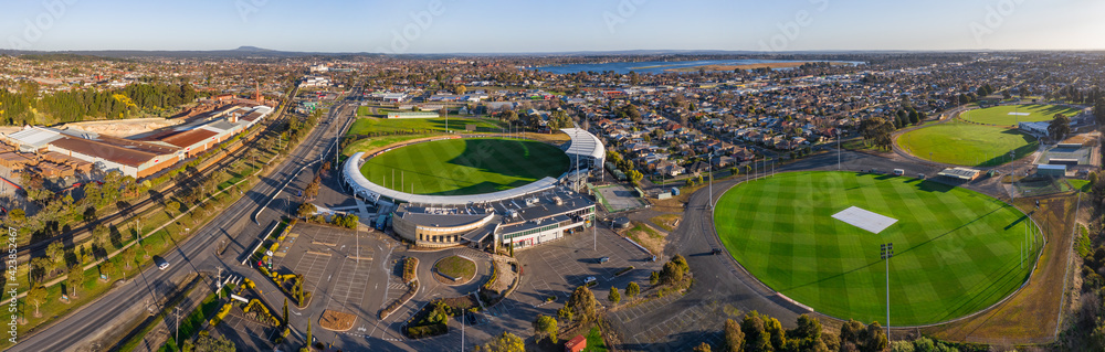 Aerial view of a AFL football stadium with surrounding vacant car park ...