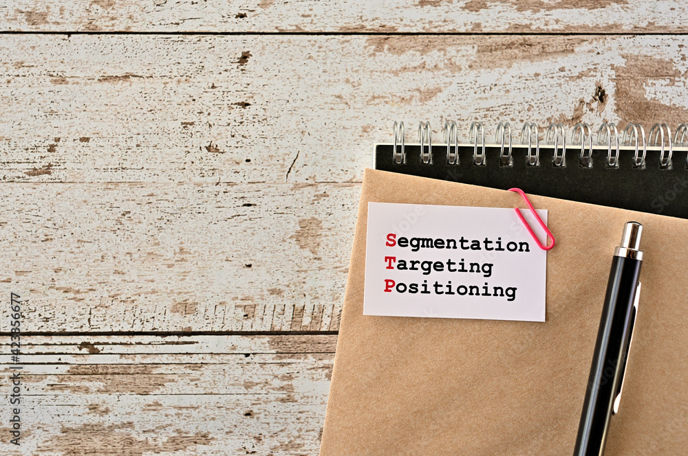 There is a piece of paper with "Segmentation, Targeting, Positioning ...