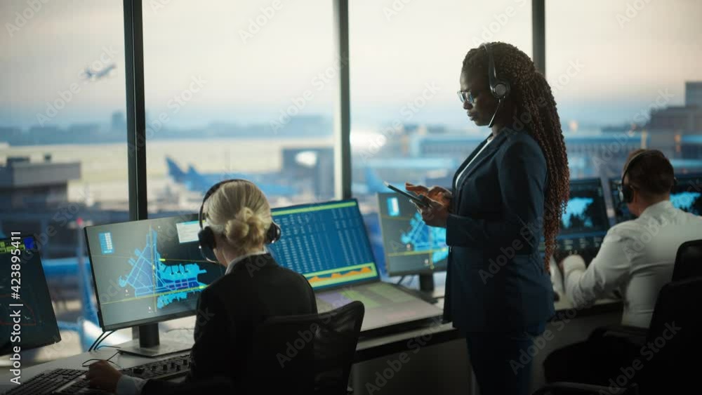 Black Female Air Traffic Controller Holding Tablet in Airport Tower ...