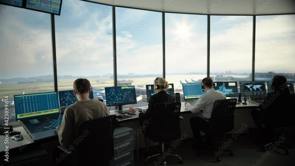 Diverse Air Traffic Control Team Working in a Modern Airport Tower ...