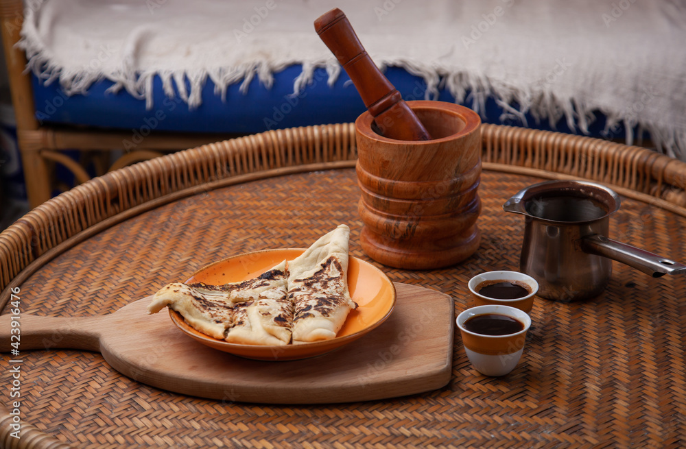 Arabic coffee and Middle eastern fatayer stuffed pie. Traditional food ...