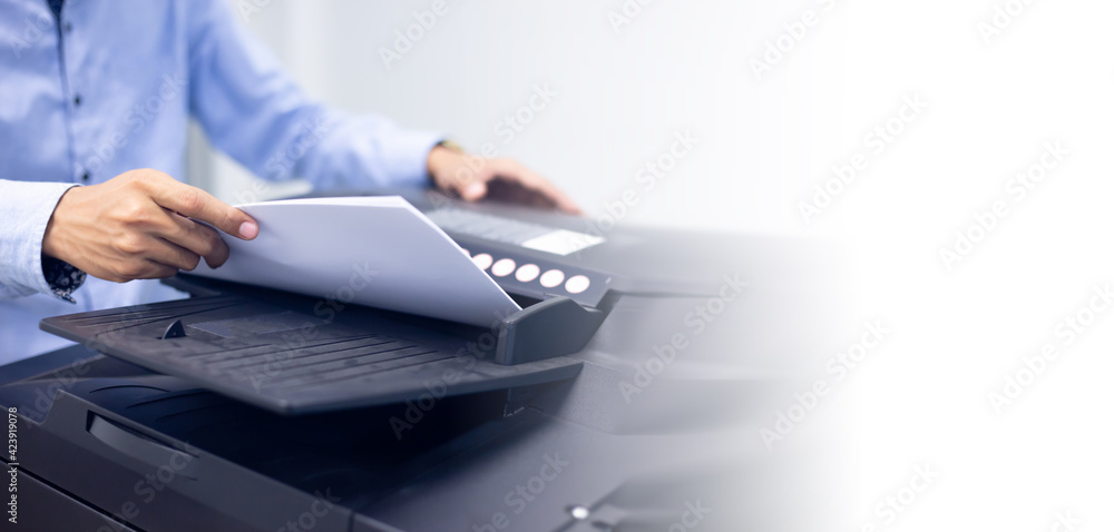 Bussiness man Hand press button on panel of printer, printer scanner ...