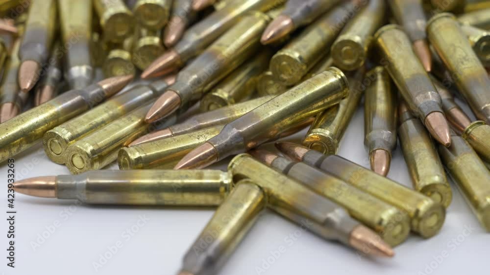 Close Up of Rifle 5.56 Reloaded Ammunition Rotating Over White ...