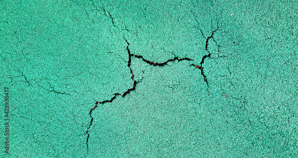 Rubber floor texture background. EPDM playground surface. Green cracked ...