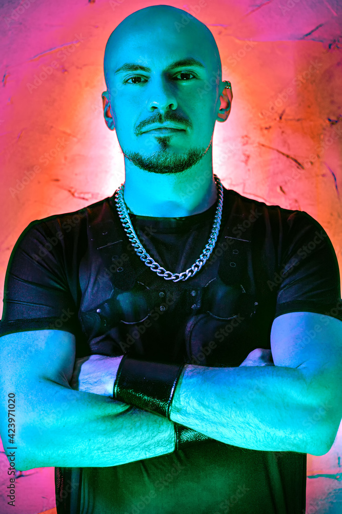 Multicolored creative artistic portrait of a rubber fetish, latex young ...
