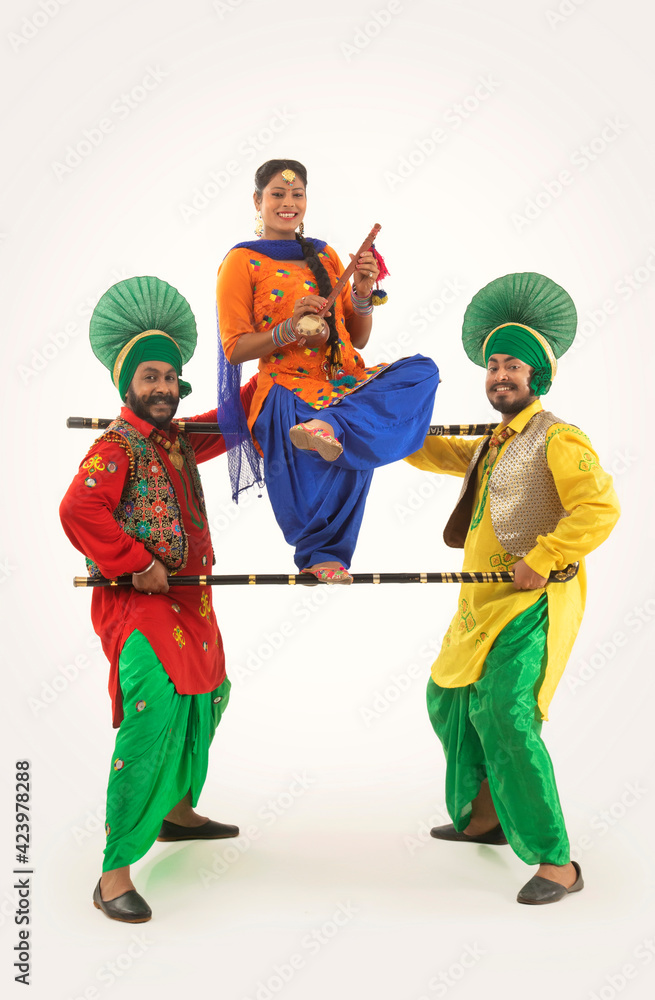 Two Bhangra and one Giddha Dancer with Khunda and Tumbi depicting a ...