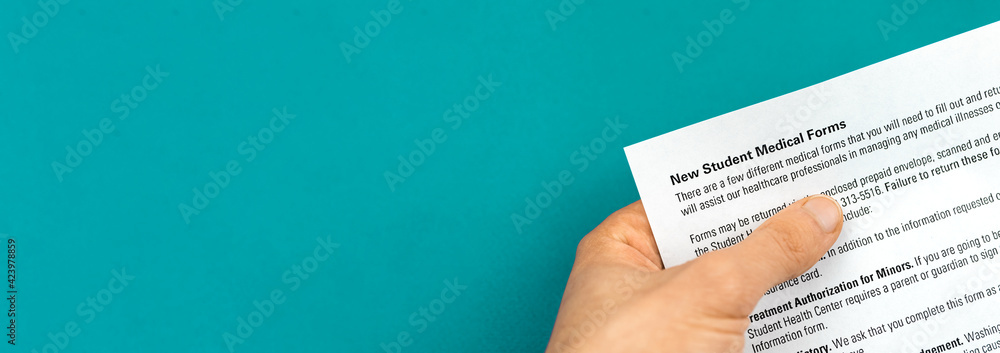 New Student medical form in boy's hand banner of child healthcare, copy ...