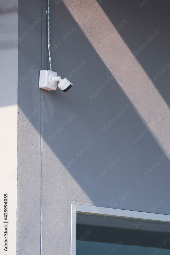 Perspective side view of security camera and flexible metal conduit ...