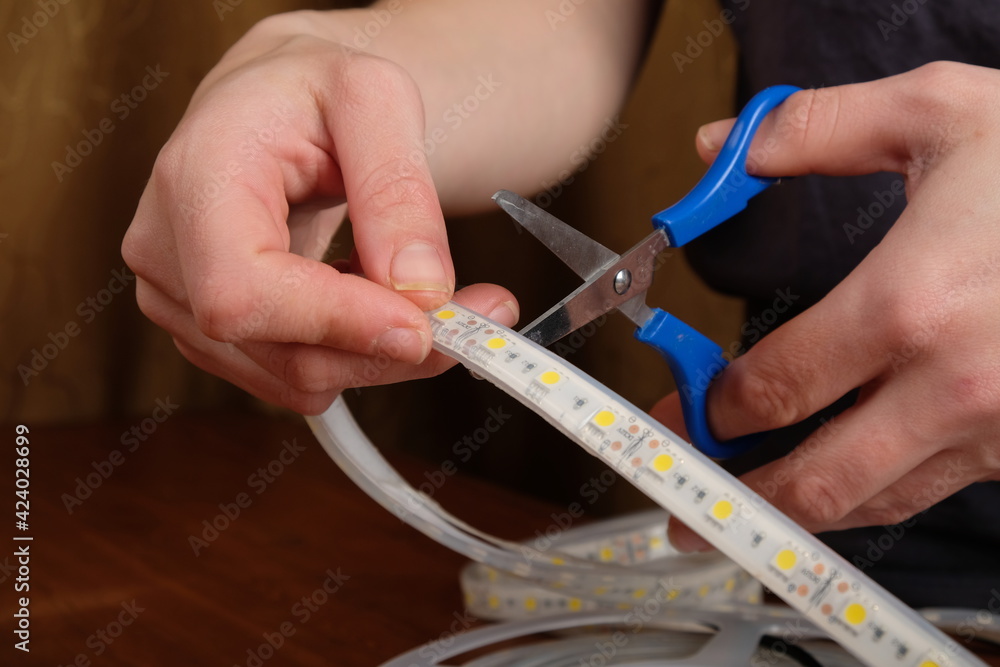 cutting off led strip,installation of diode lighting Stock Photo ...