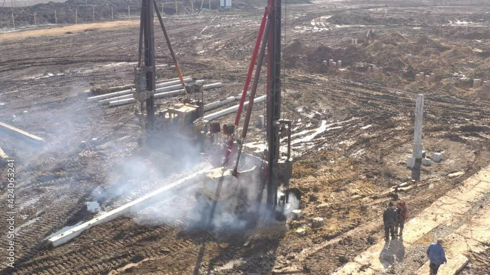 Video Stock Excavation at a construction site, diesel pile driving ...