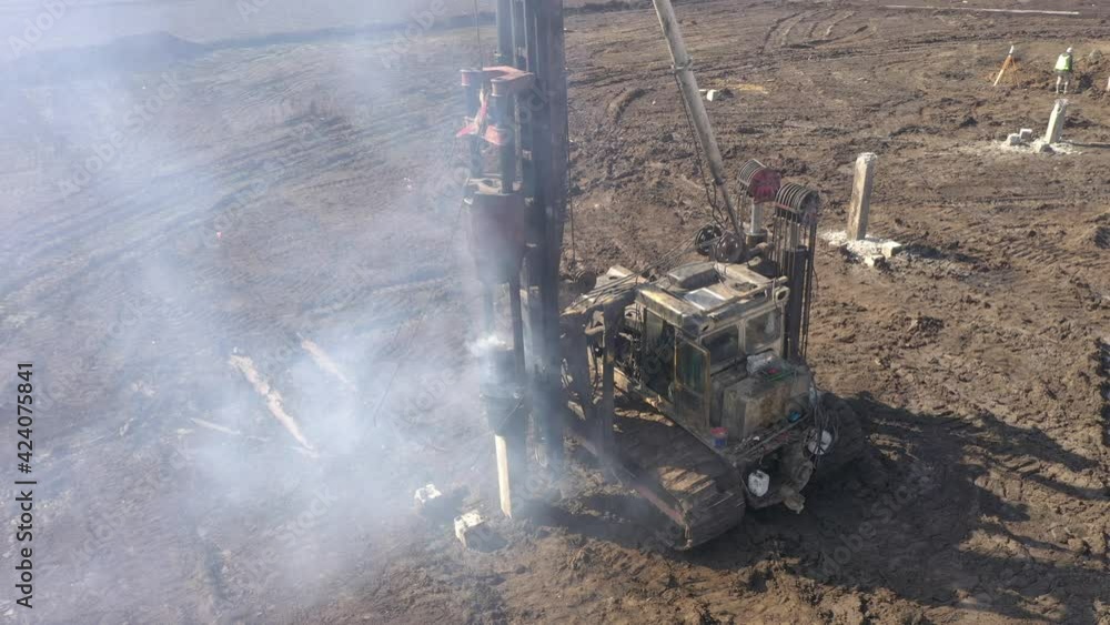 Video Stock Excavation at a construction site, diesel pile driving ...