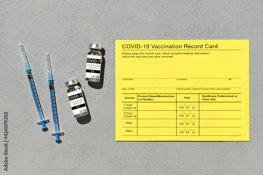 Coronavirus vaccination concept. Top view of yellow vaccination record ...