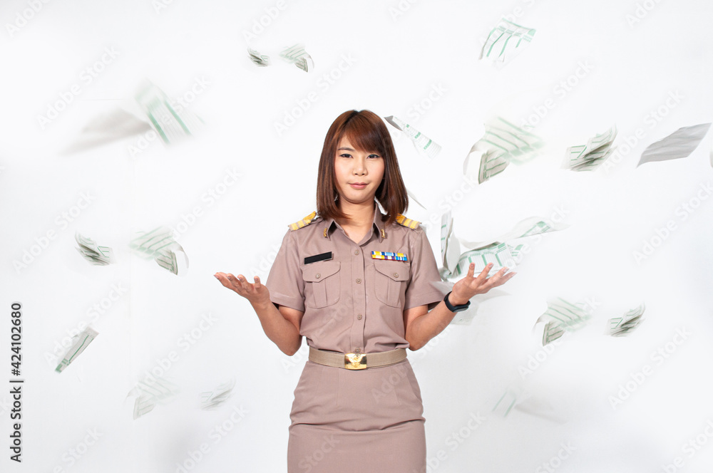 Female thai teacher in uniform standing with white background throwing ...