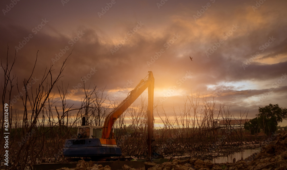 Excavator dredging mud at mangrove. Backhoe digging mud at construction ...