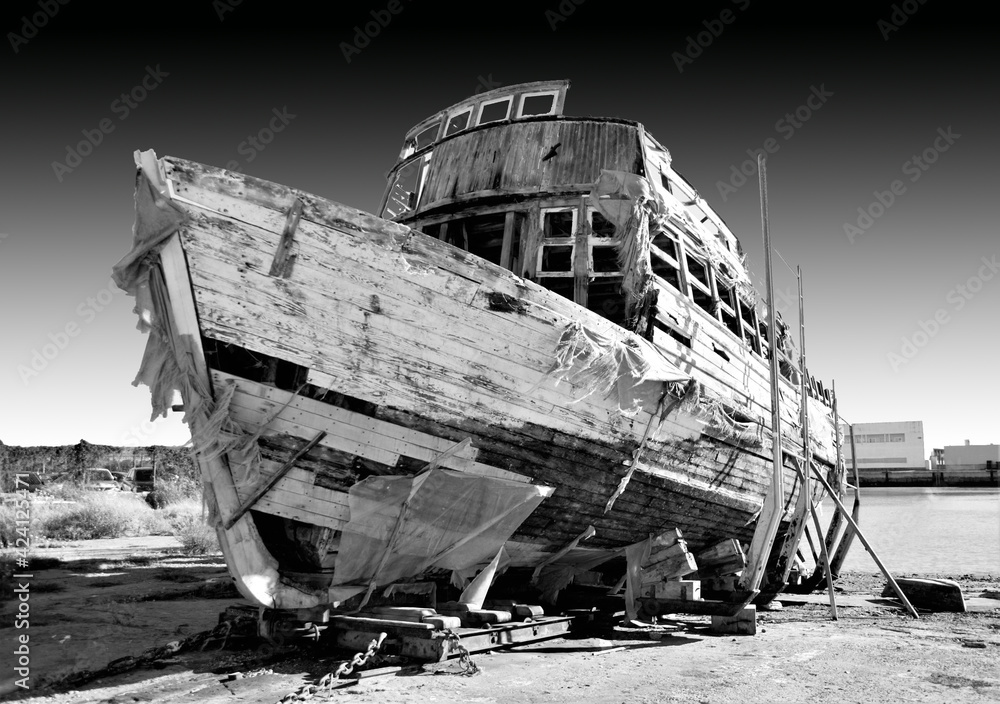 Black and white photograph of an old rotting boat for transporting ...