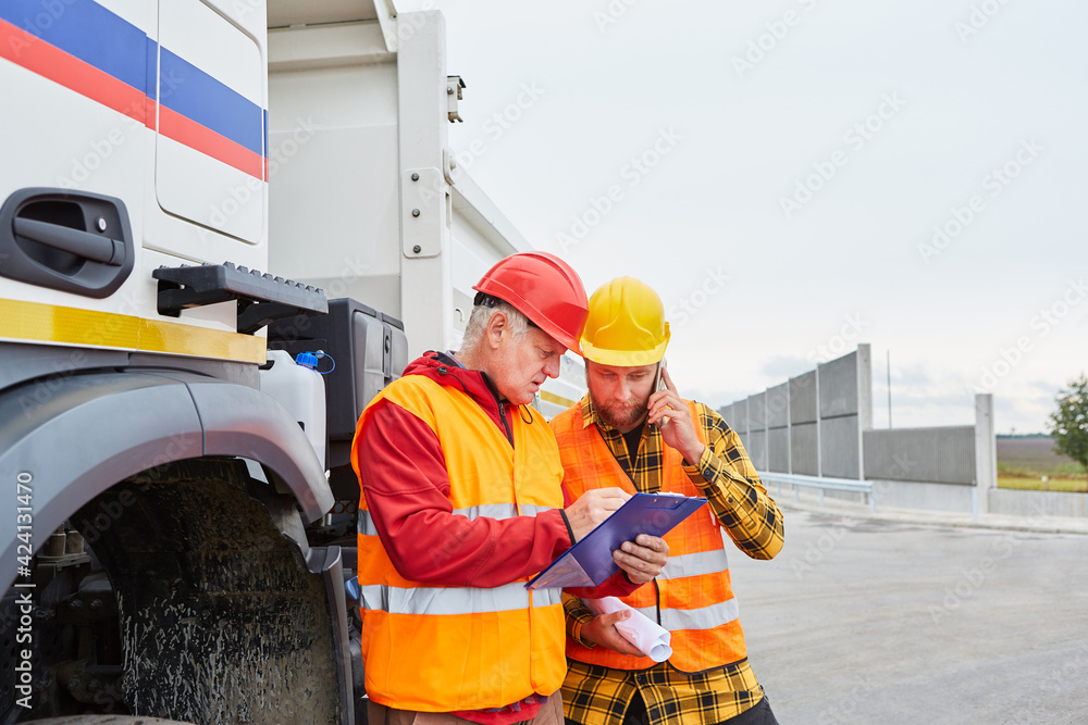 Construction worker and foreman with checklist Stock Photo | Adobe Stock