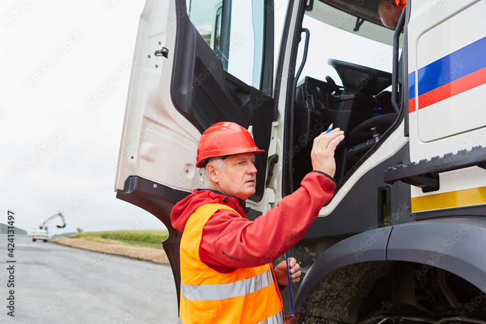 Road construction worker speaks to truck driver Stock Photo | Adobe Stock
