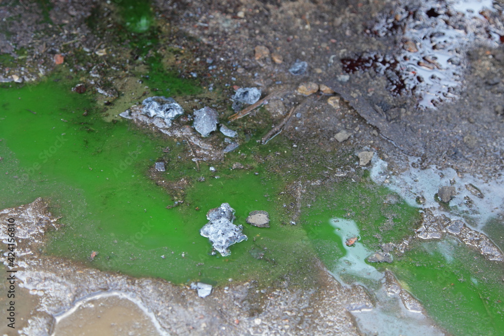Leak green antifreeze puddle to the ground after car overheat ...