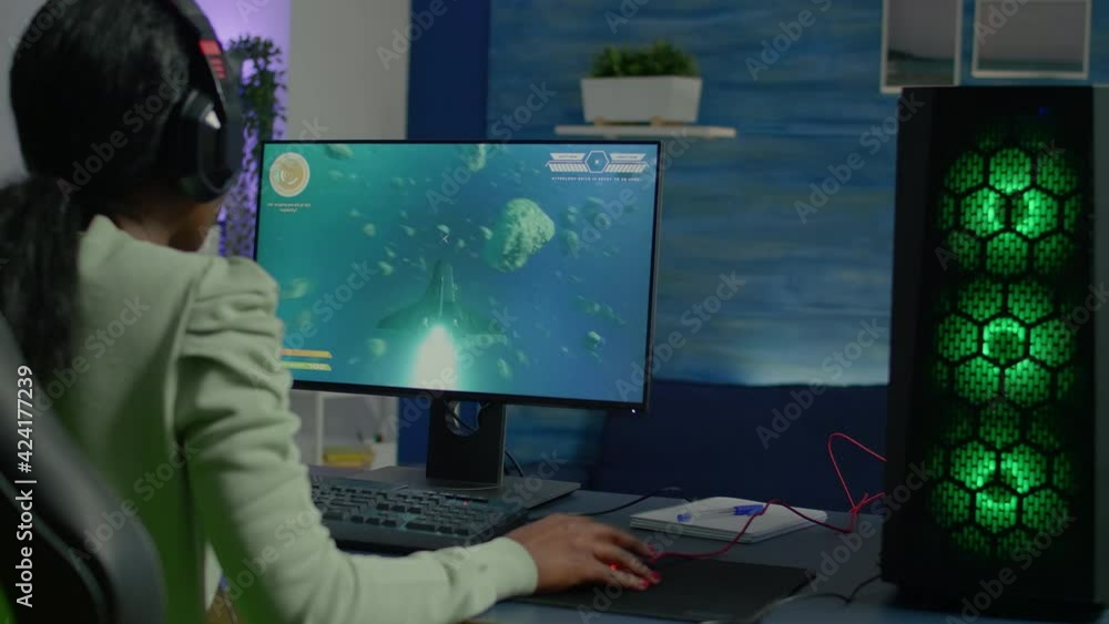 Addicted african video gamer performing cyber video games using ...