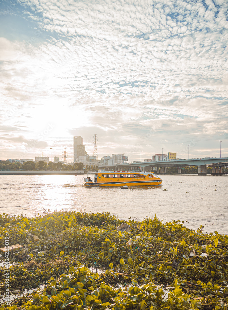 Saigon Water bus moving across Saigon river to urban center. This a new ...