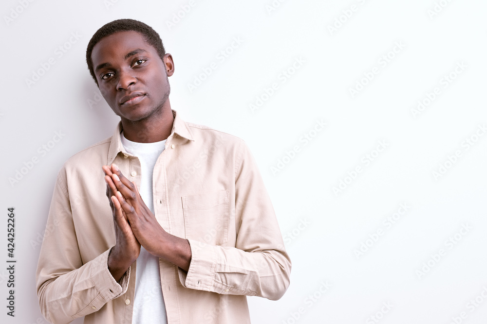 calm and wise black man keeping hands together, thinking Stock Photo ...