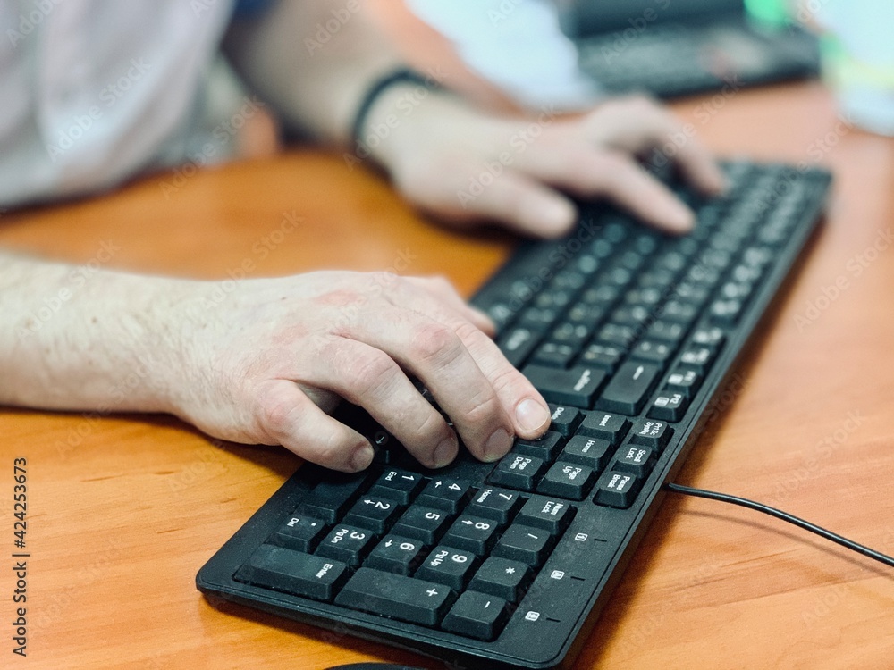 Office manager male hands typing on computer keyboard, closeup ...