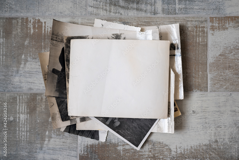 Photo & Art Print Old photos scattered on the floor top view., Natali