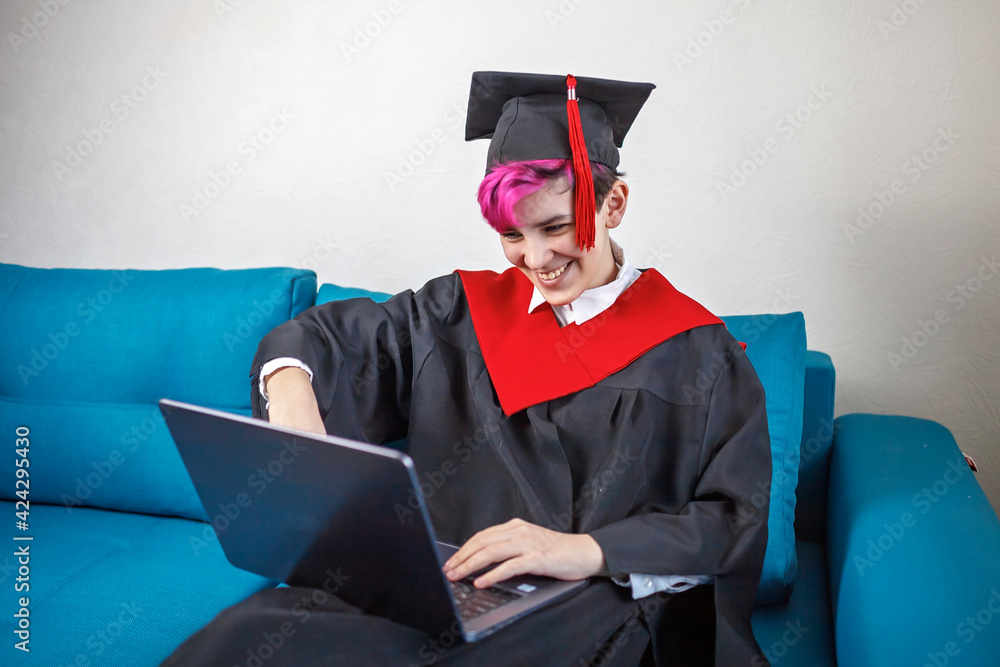 Virtual graduation and convocation ceremony. Excited student wearing ...