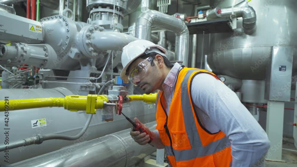 An engineer man or worker, people working in industry factory. Chiller ...