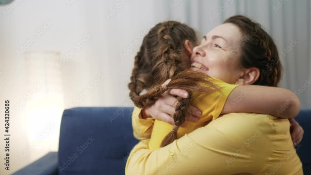 daughter hugs mom. happy family a lockdown stay home concept. mom and ...