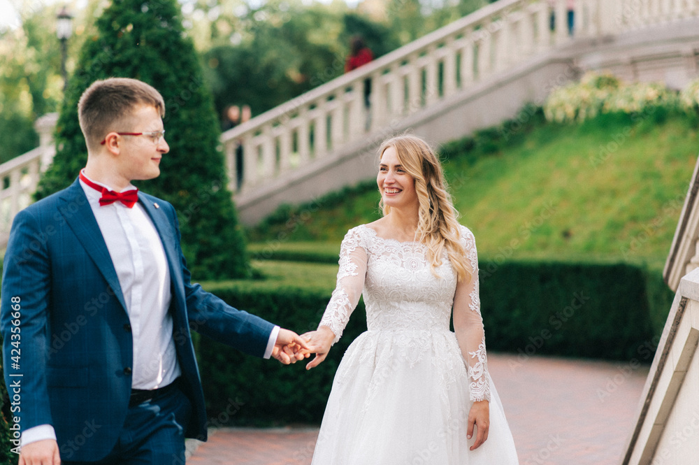 Happy husband and wife. Wedding day. Beautiful nature. Walk during the ...