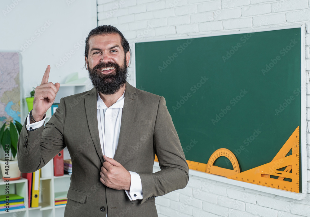 happy brutal bearded man work in classroom having inspiration. prepare ...