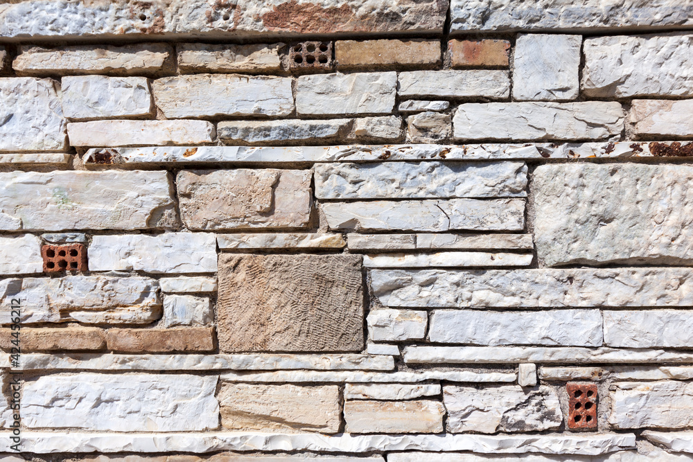 Marble wall, made of several layers of marble pieces put in place ...