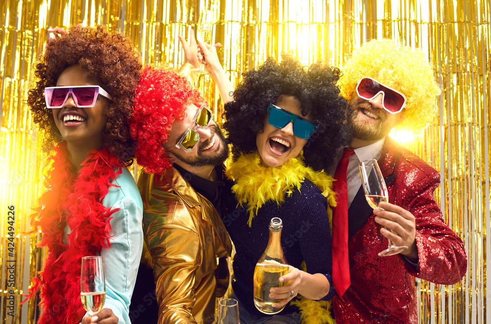 Happy millennials friends celebrating drinking champagne. Funny crazy ...