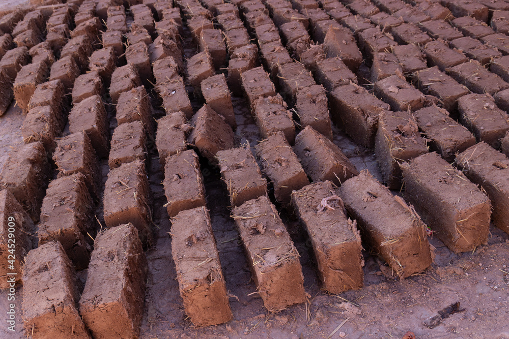 Foto de Mudbricks are dried in the sun in Morocco. A mud-brick is an ...