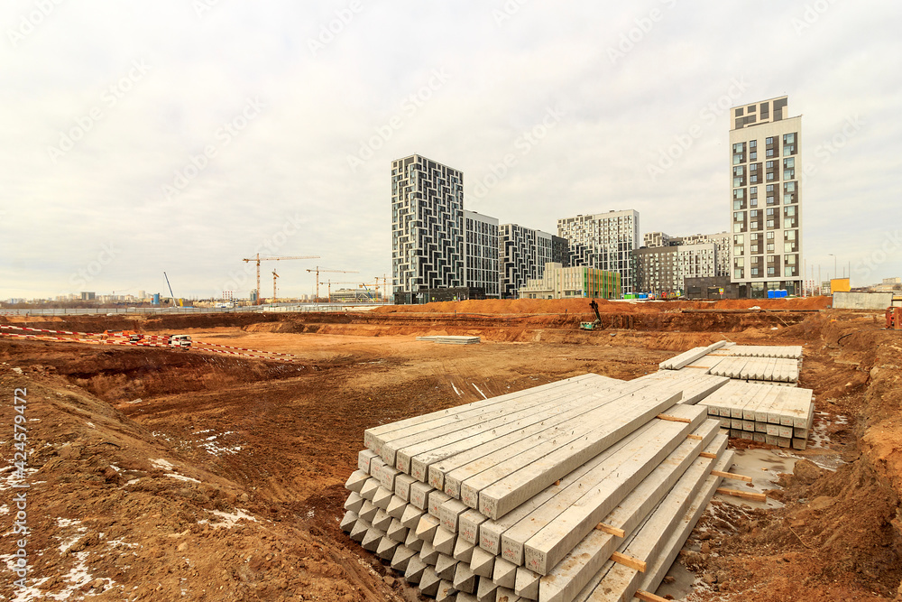 Reinforced concrete piles of new building, tower crane. Hydraulic ...