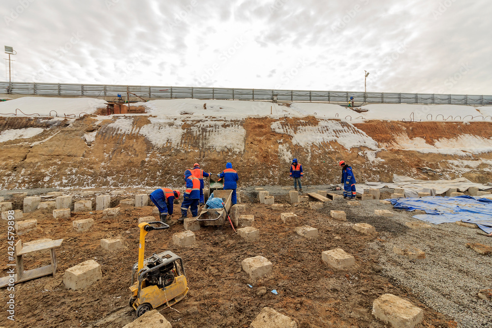 Reinforced concrete piles of new building, tower crane. Hydraulic ...