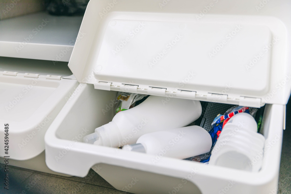 Waste sorting at home. Containers for different types of waste ...