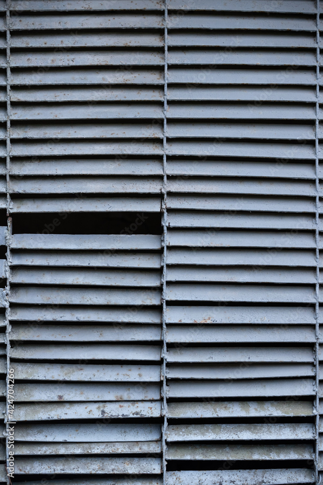 Close-up of a metal ventilation grill on the street. Old rusty ...