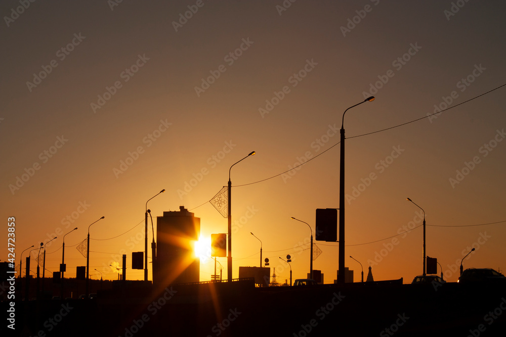Horizontal outdoor photography of a city road skyline with silhouettes ...