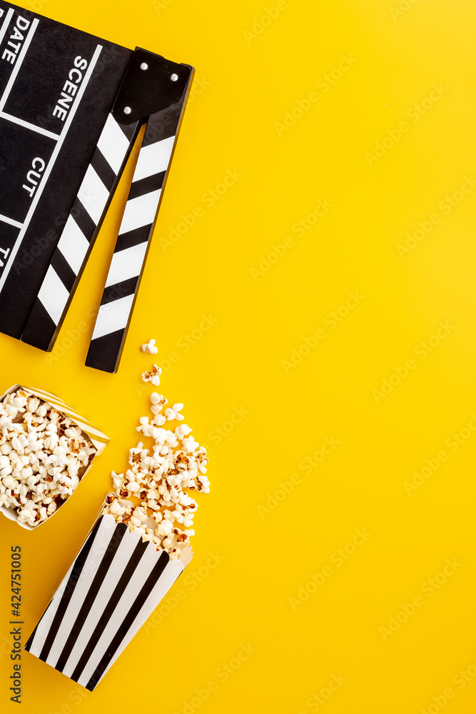 Layout of film reel with popcorn and clapperboard. Cinema concept Stock ...