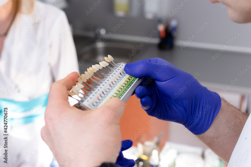 Tooth color chart in the rivers of the dentist. Vita scale. Stock Photo ...